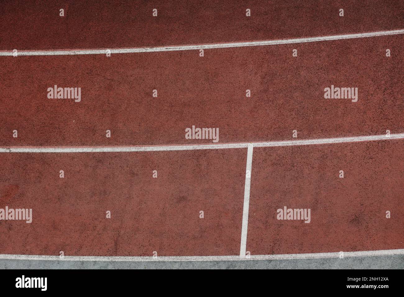Bright red artificial running track with curved white lines Stock Photo ... Bright red artificial running track with curved white lines Stock Photo ...