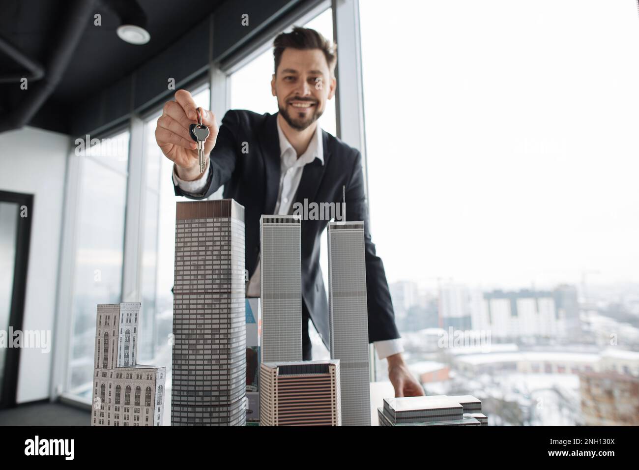 Focus on keys in hand of real estate manager homeowner businessman ...