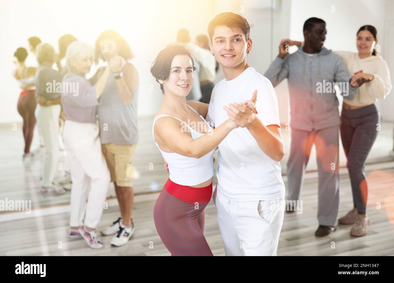 Cheerful people rehearsing dance routine hi-res stock photography and ...