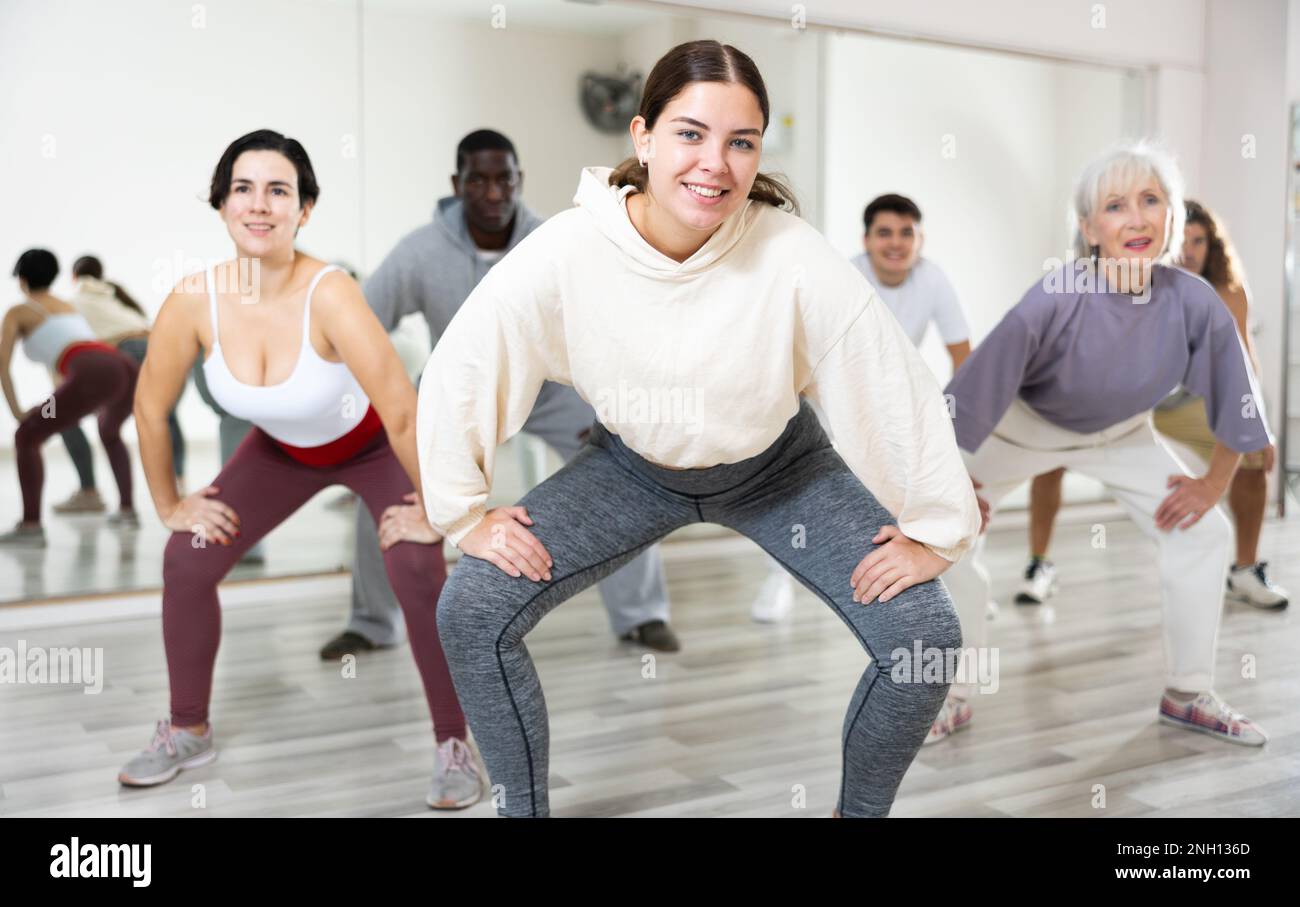 Girl learning to dance krump with group in choreographic studio Stock ...