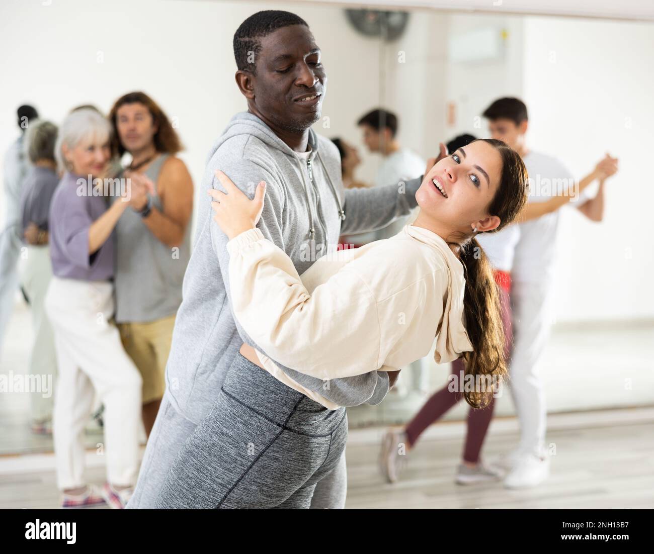 Cheerful people rehearsing dance routine hi-res stock photography and ...