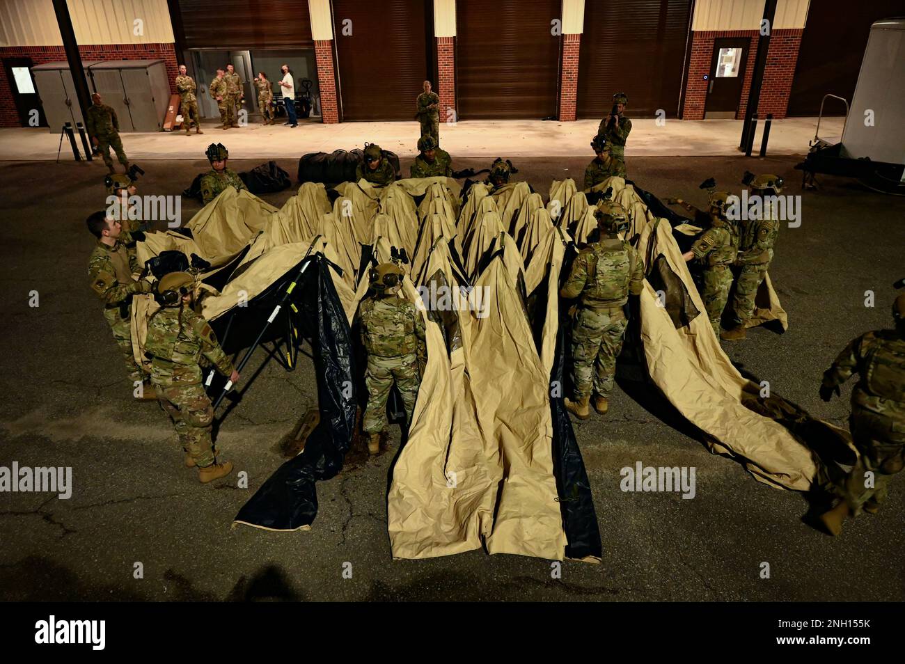 U.S. Air Force Airmen assigned to the 1st Combat Camera Squadron set up ...
