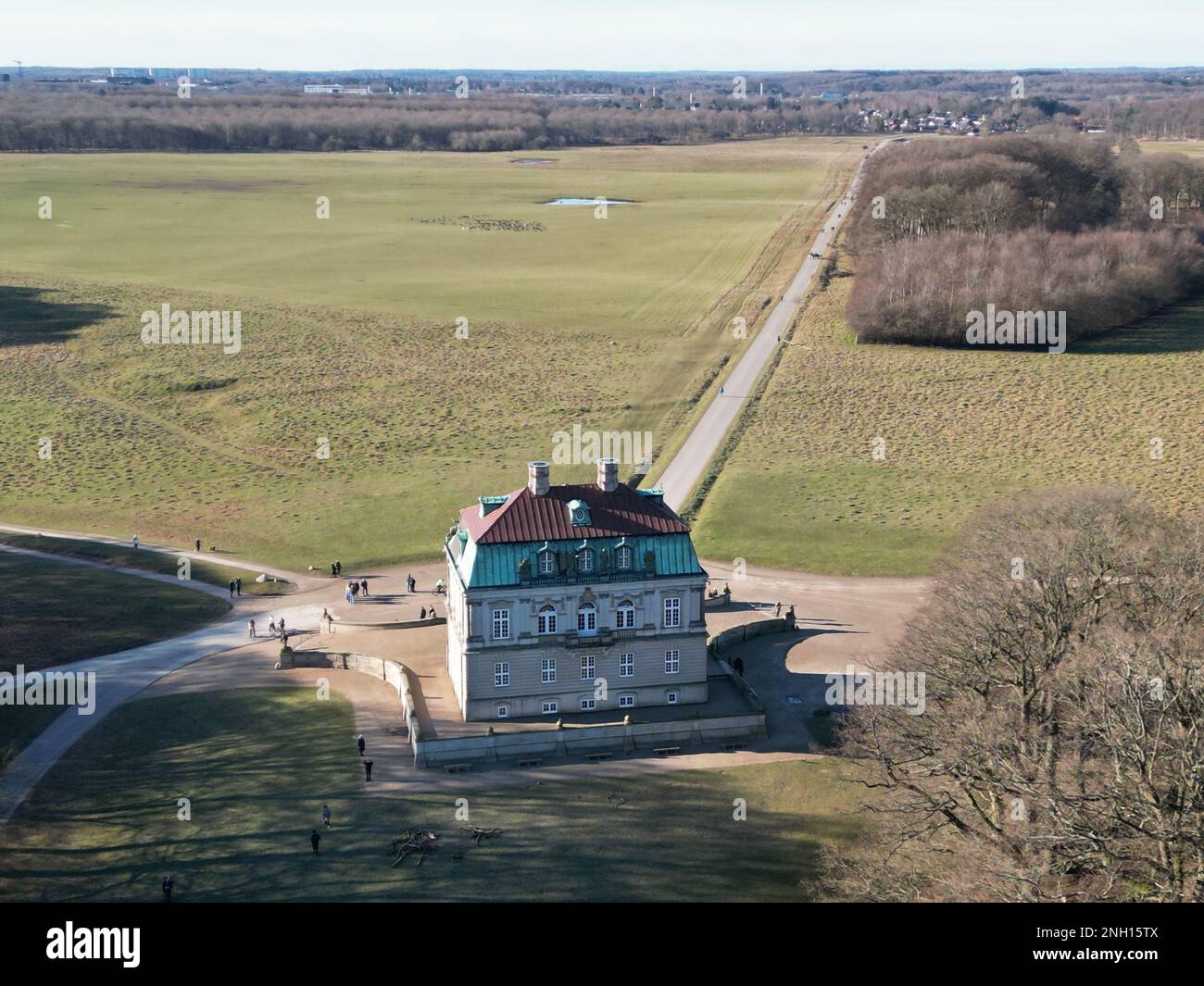 A modern concrete building with a turret roof featuring sharp angles ...