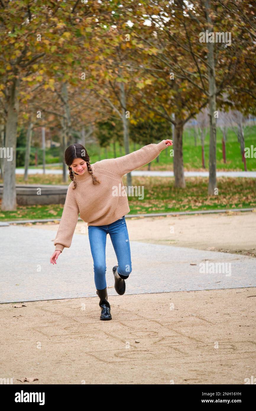 Playing hopscotch caucasian hi-res stock photography and images - Alamy