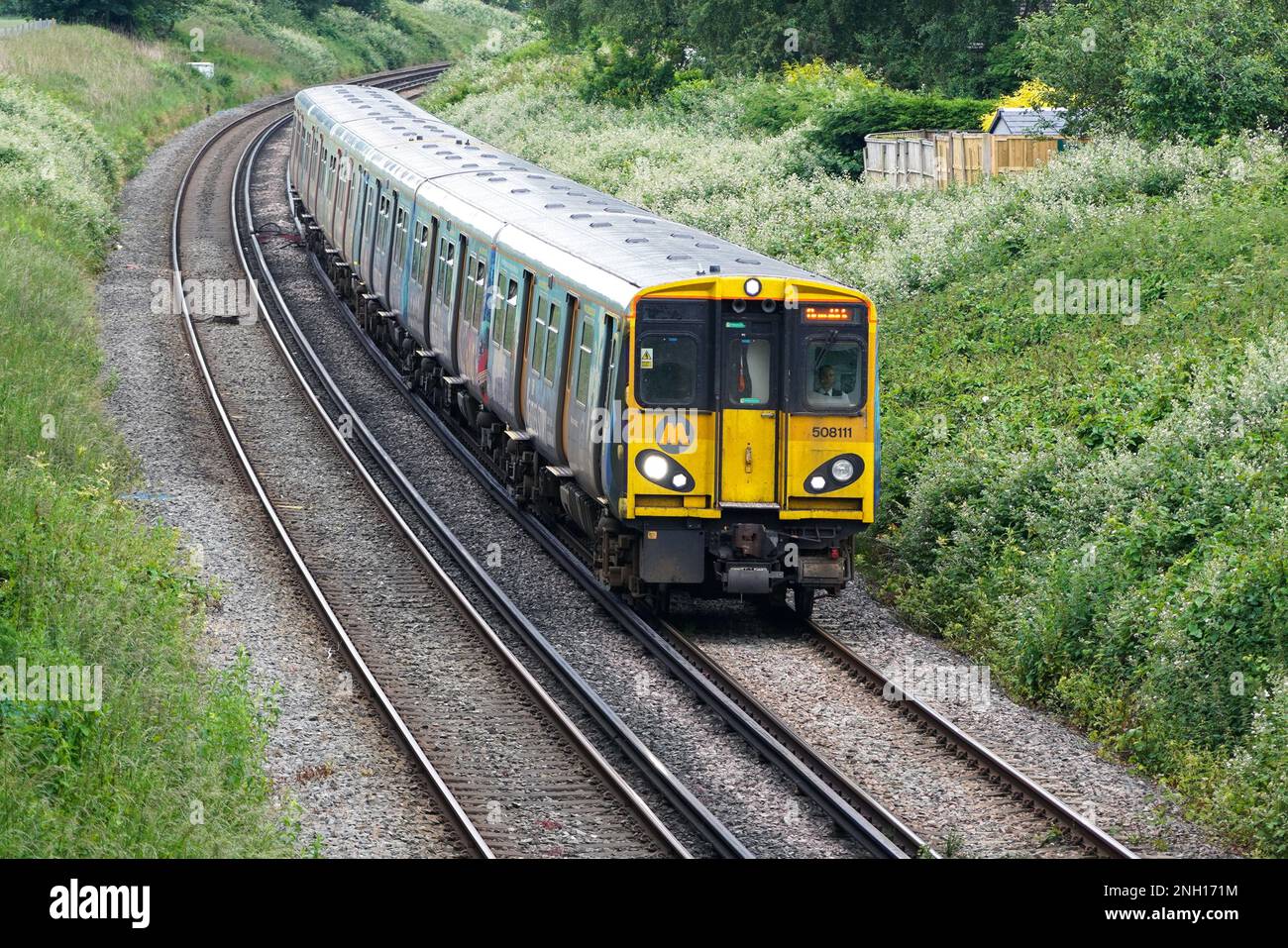 Merseyrail train arriving at Maghull North rail station Stock Photo - Alamy