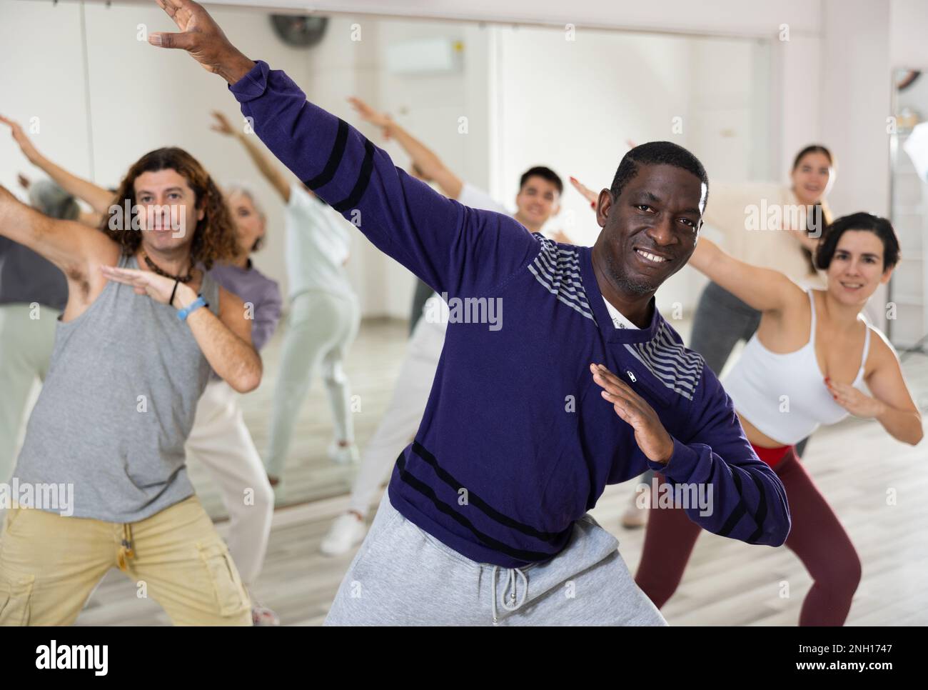 Group of adult people practices dance aerobics Stock Photo - Alamy