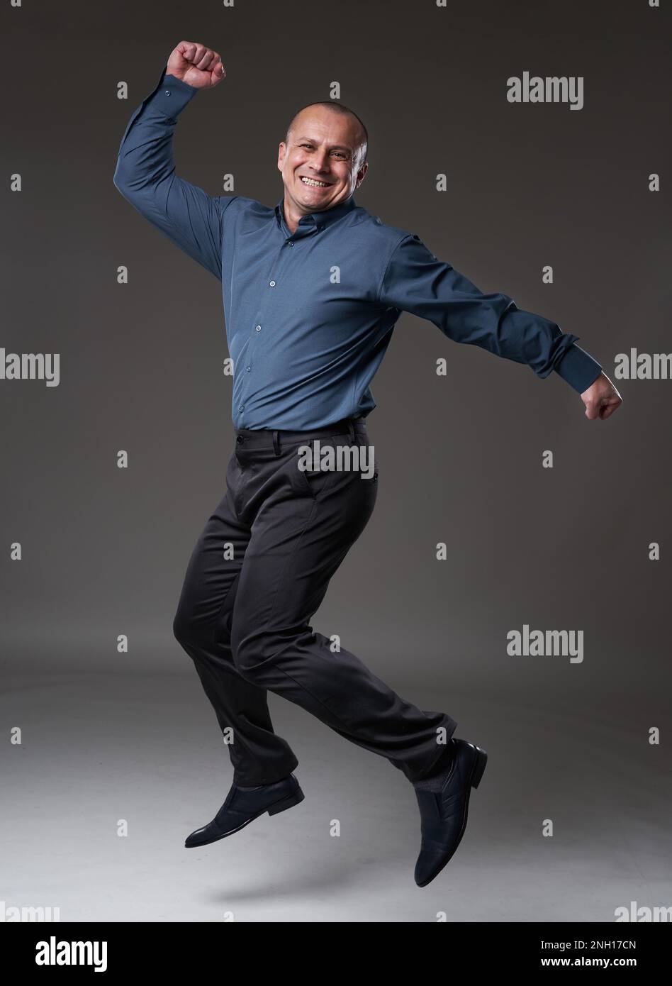 Exhilarated successful happy businessman dancing, celebrating victory ...
