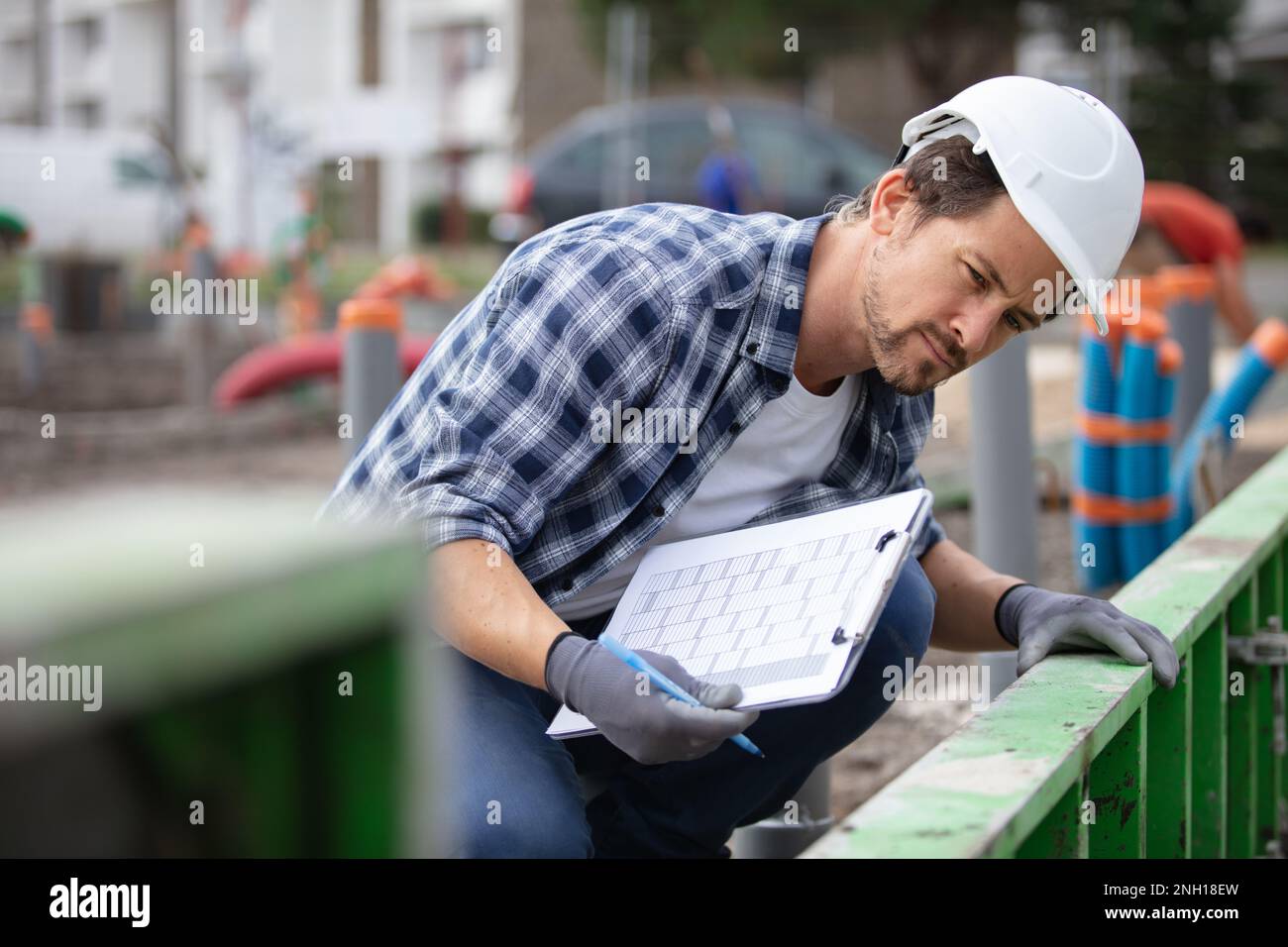 foreman inspecting metal structure on site Stock Photo - Alamy