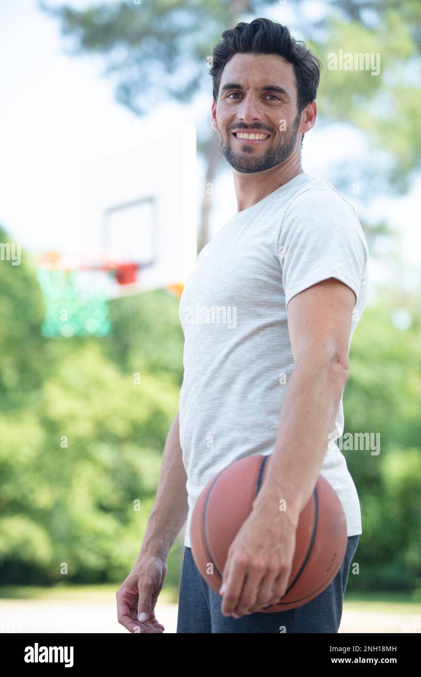 Confident athletic man stands hi-res stock photography and images - Alamy