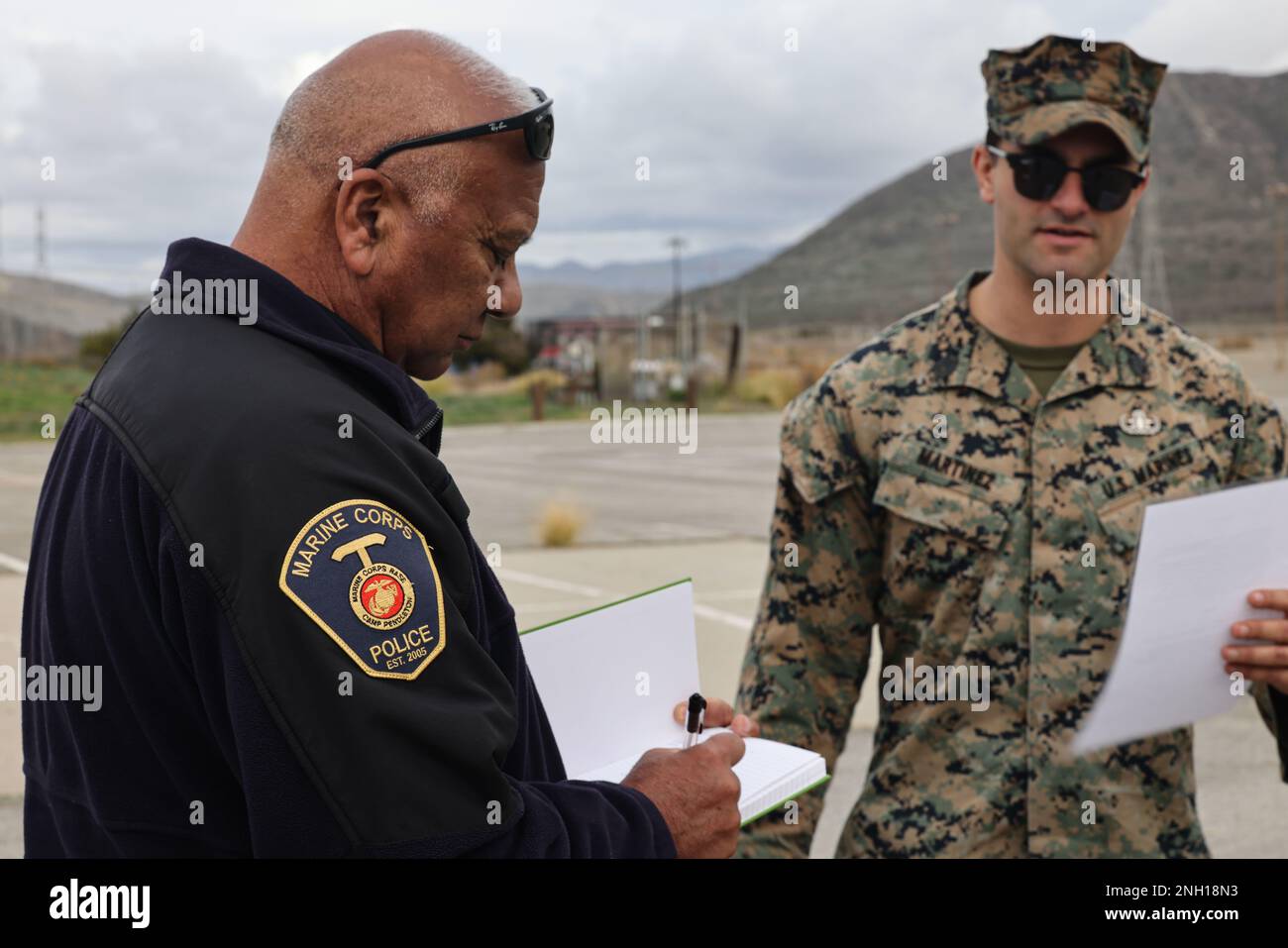 Lt. Gabriel Flores, left, a watch commander with the Provost Marshal’s Office, Security and ...