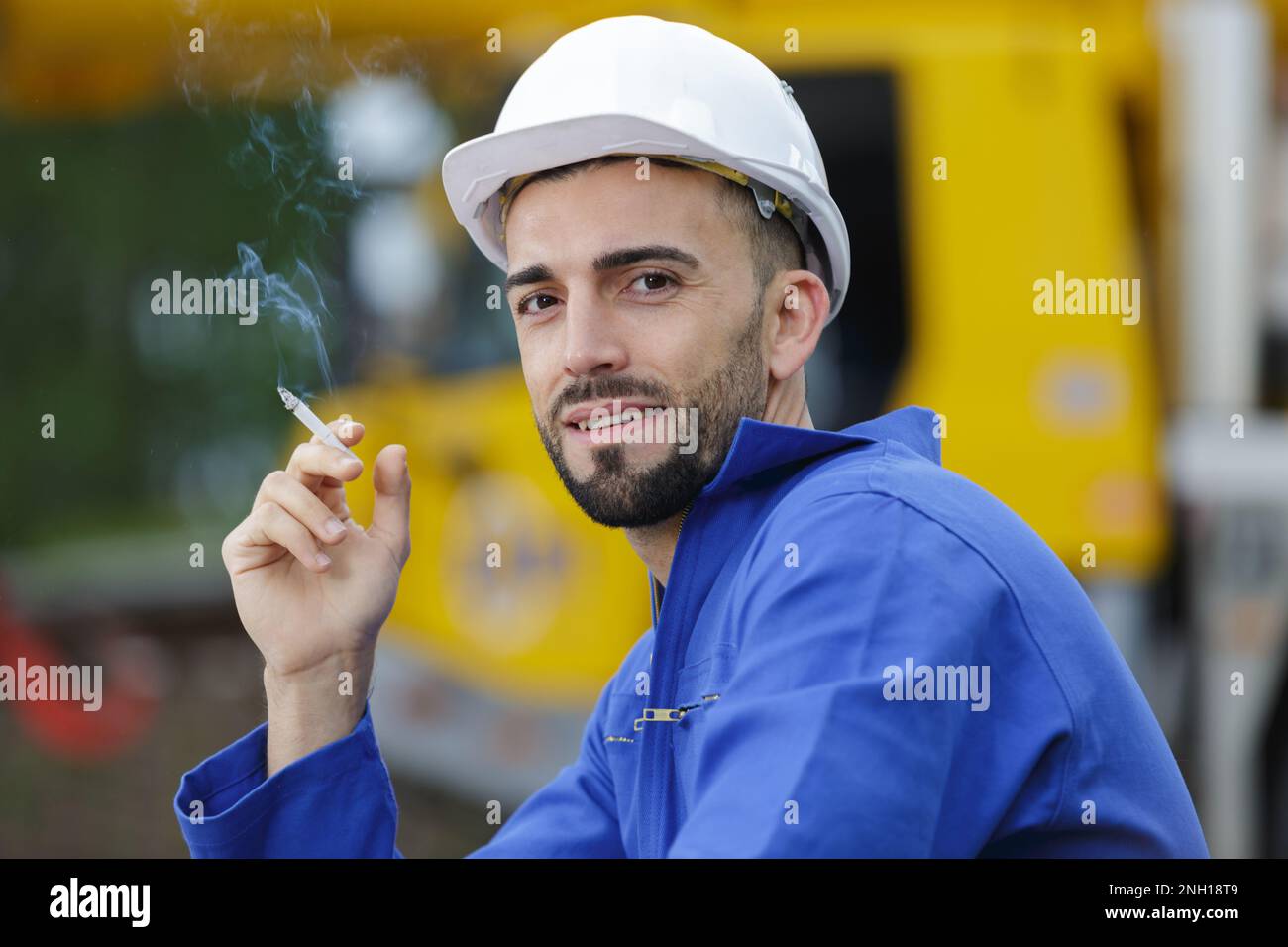 worker with hardhat on smoking Stock Photo - Alamy