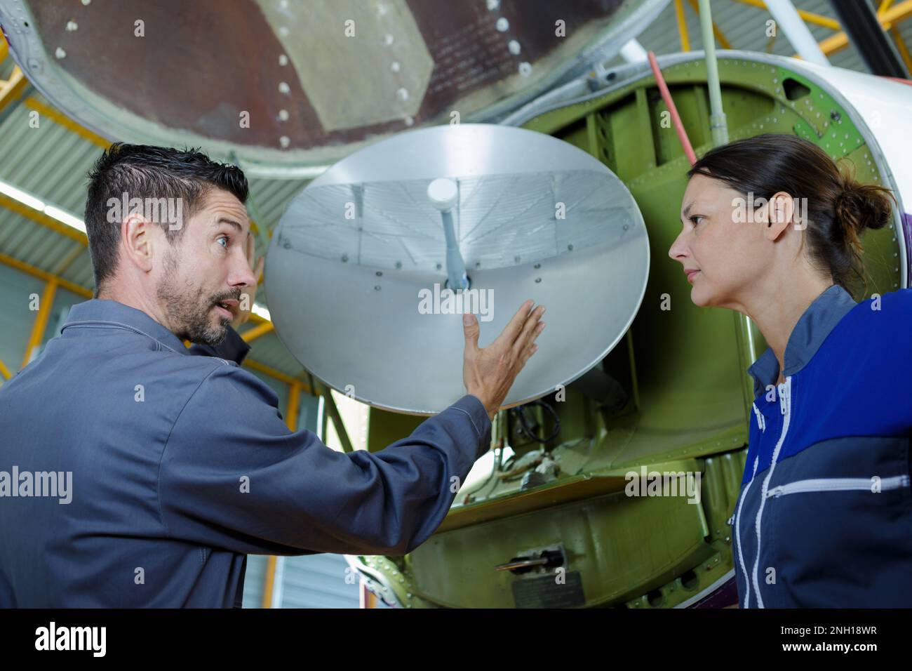 two engineers working on earth satellite Stock Photo - Alamy