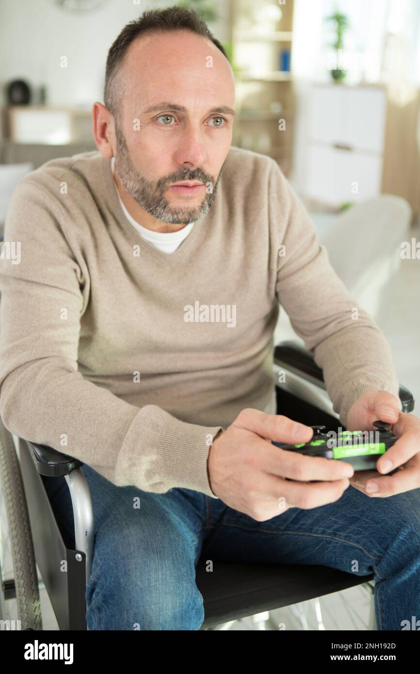 Disabled man playing video game hi-res stock photography and images - Alamy