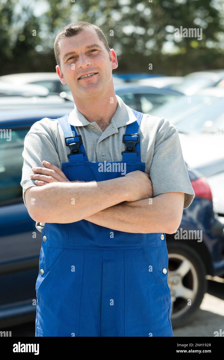 portrait of male car mechanic wearing dungarees Stock Photo - Alamy