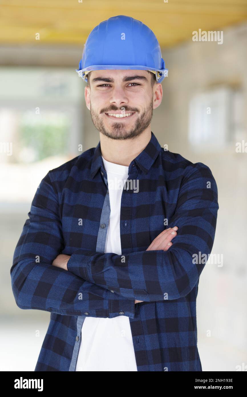 portrait of young tradesman with his arms crossed Stock Photo - Alamy