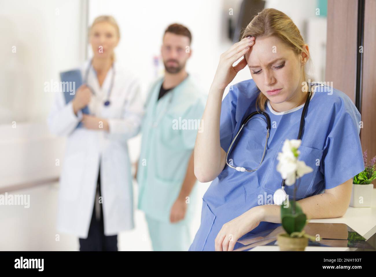 nurse or doctor woman suffering from stress and frustration Stock Photo ...