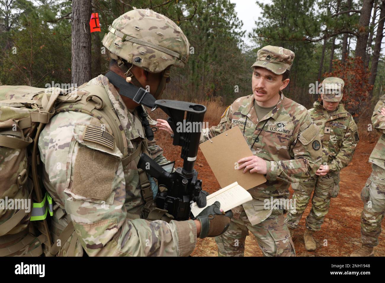 U.S Army soldiers from 18th Field Artillery listen to instruction from ...