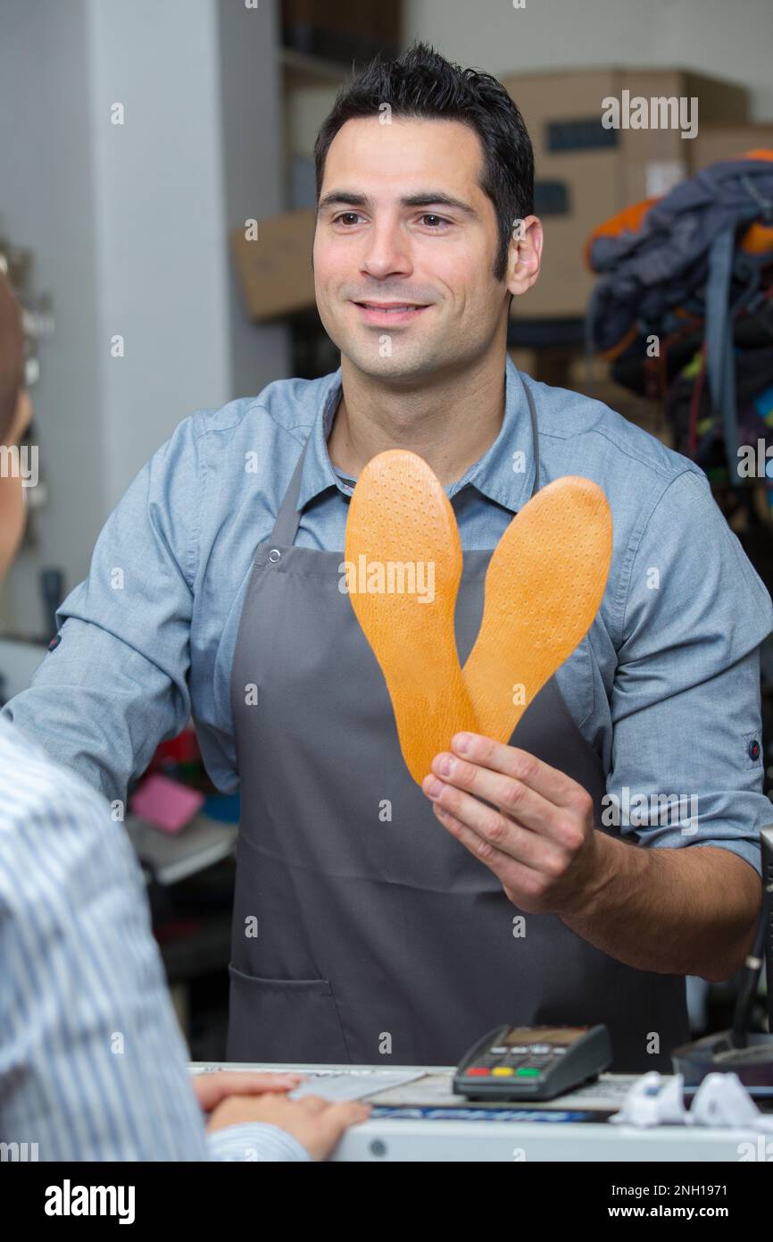 male worker leather soles concept Stock Photo - Alamy