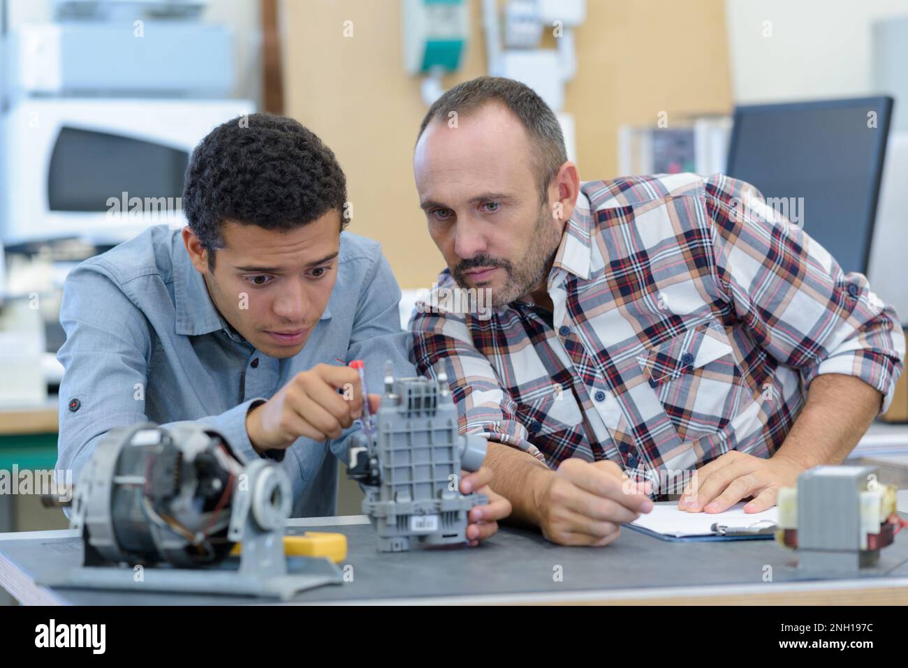 young mechanic apprentice working on milling machine Stock Photo - Alamy