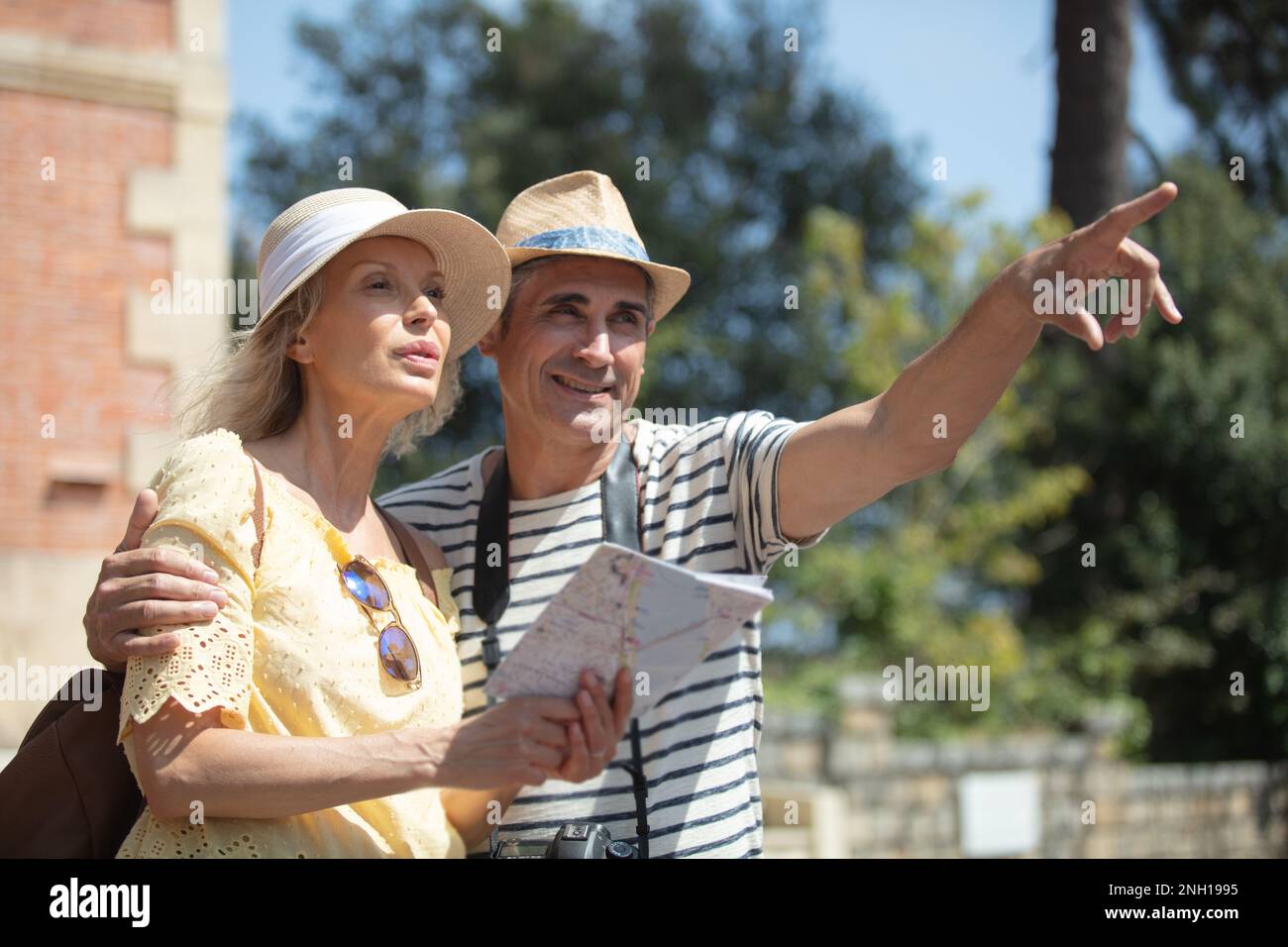 Happy middle aged couple map in hi-res stock photography and images - Alamy