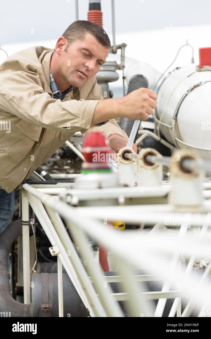portrait of factory worker operating machine Stock Photo - Alamy