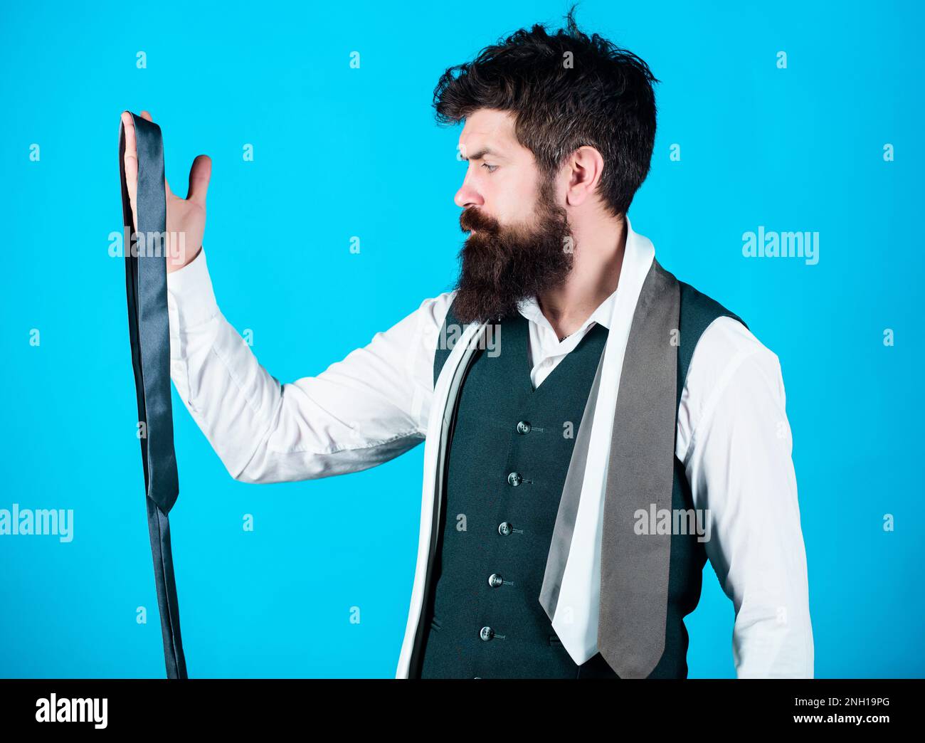 Guy with beard choosing necktie. Gentlemens guide. How to choose right ...