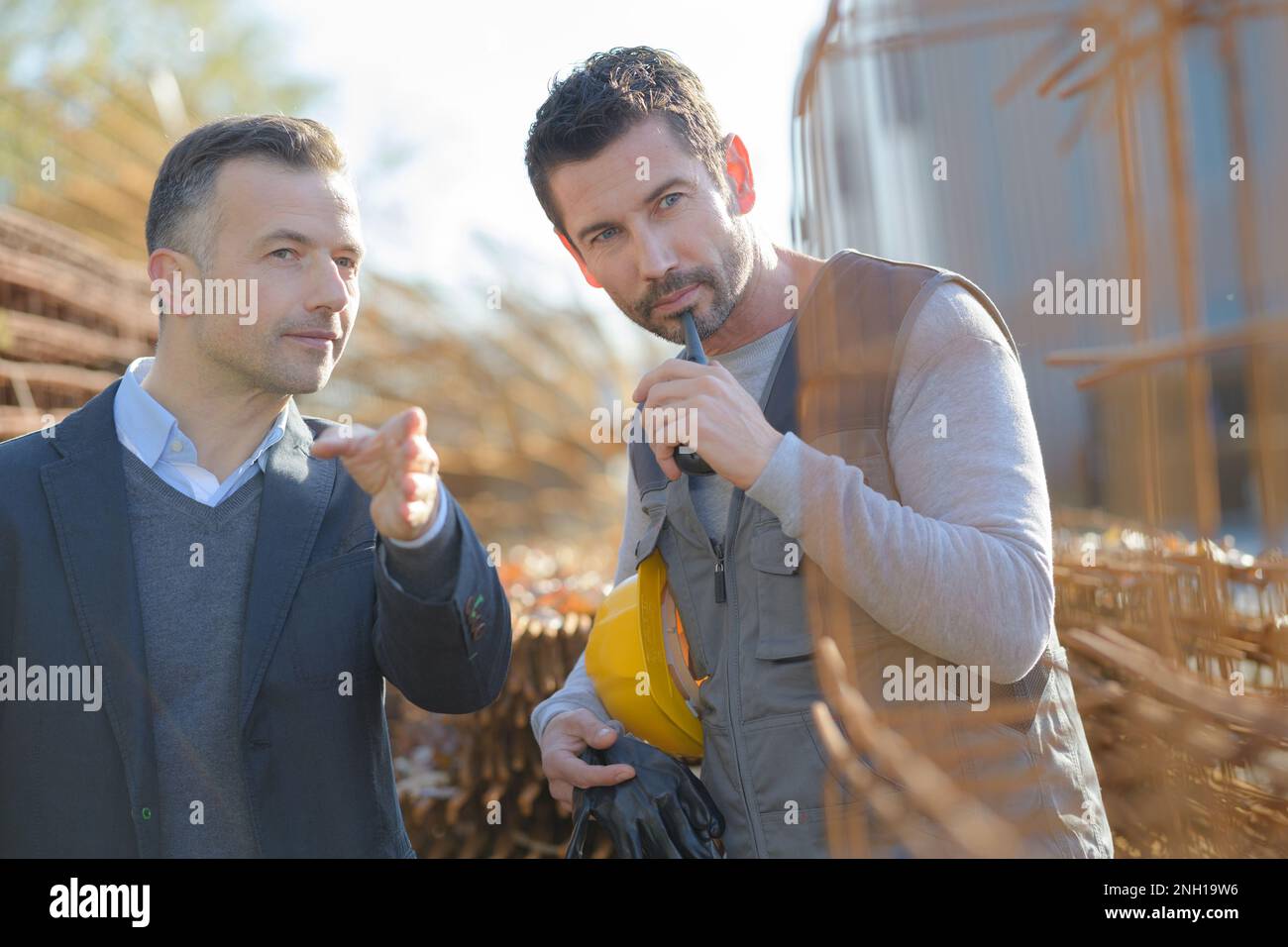 worker and manager of steel bar manufacturing site Stock Photo - Alamy
