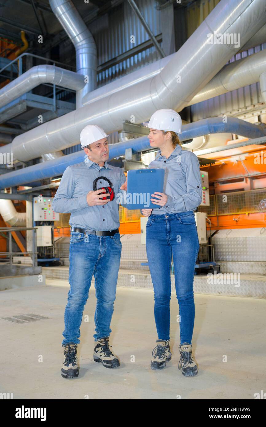 factory and industrial engineers having a conversation Stock Photo - Alamy