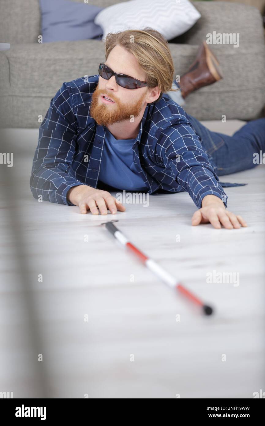 Man with walking stick fallen hi-res stock photography and images - Alamy