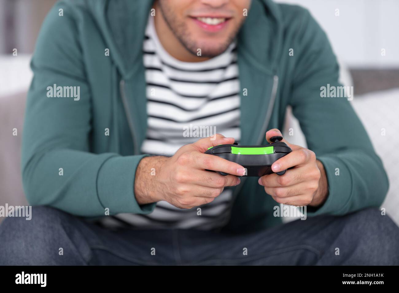 the guy is playing on the console Stock Photo - Alamy