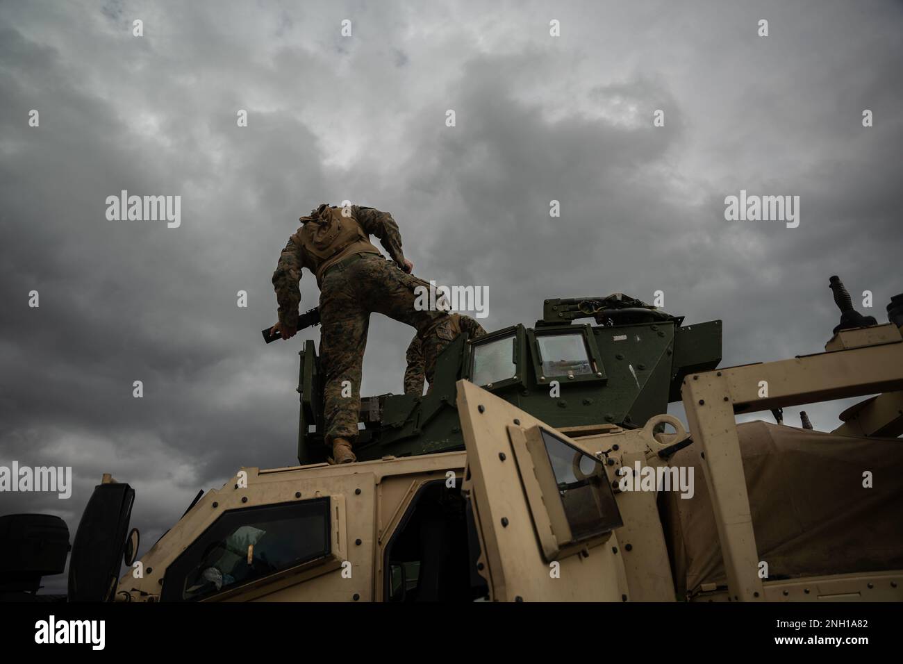U.S. Marine Corps machine gunners with 3rd Battalion, 4th Marines, load ...
