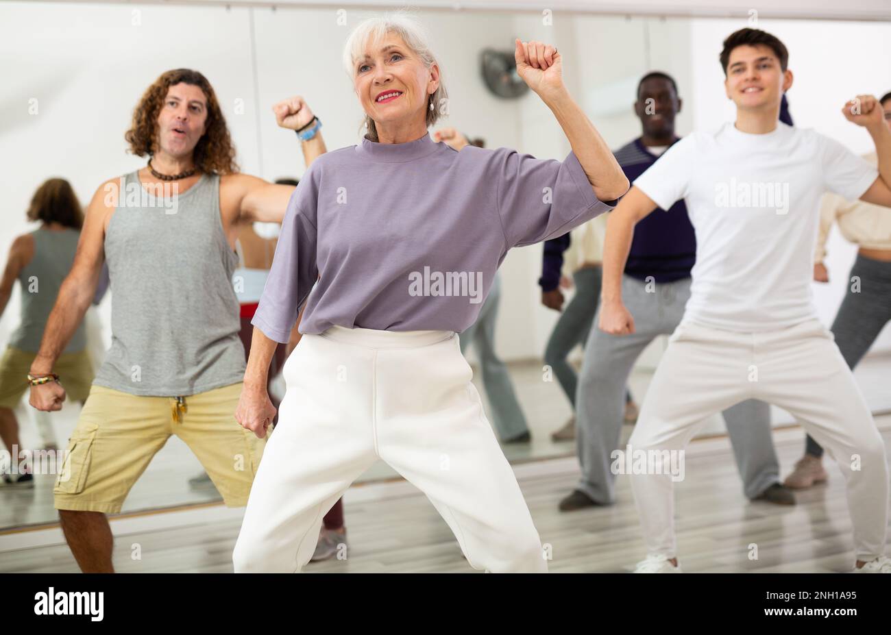 Elderly lady learning modern dynamic dances in choreography class Stock ...
