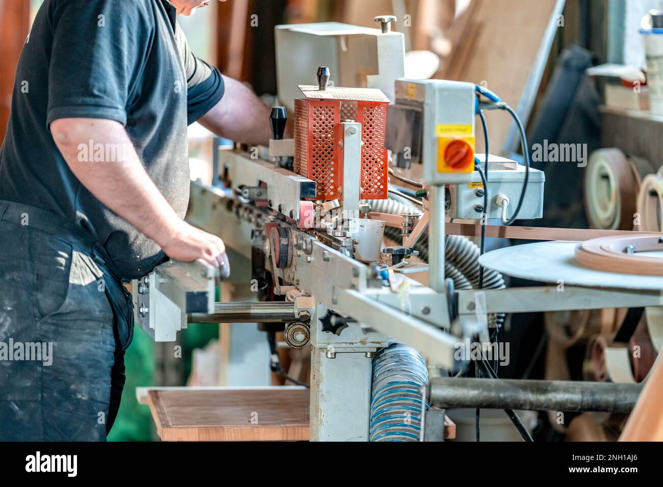 machine treatment of the edge of the laminate board in carpentry Stock ...