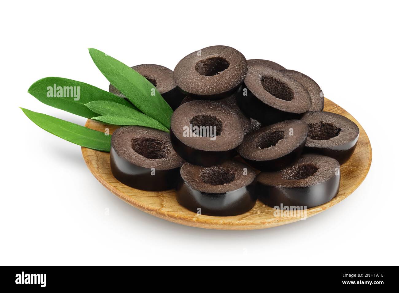 Black olive slices in wooden bowl isolated on a white background with ...