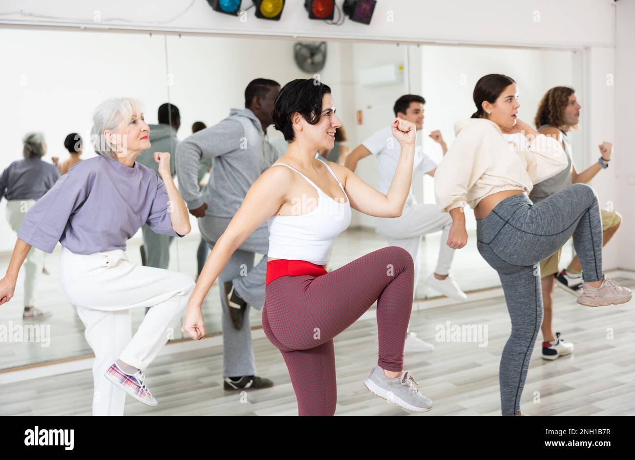 Group of people of different nationalities learn sports dance Stock ...