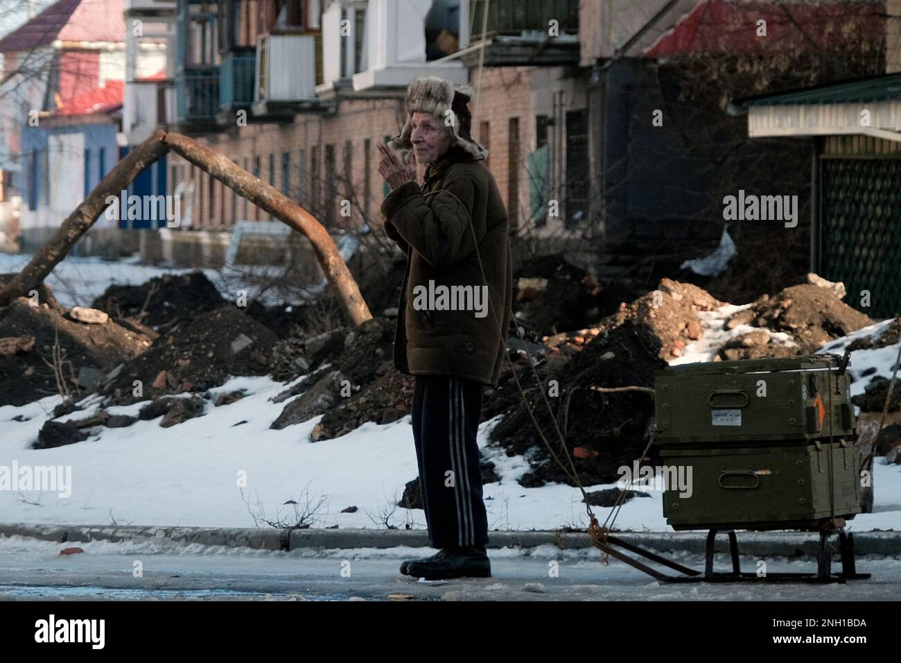 A local resident walks along a street in Bakhmut, Ukraine, Sunday, Feb ...