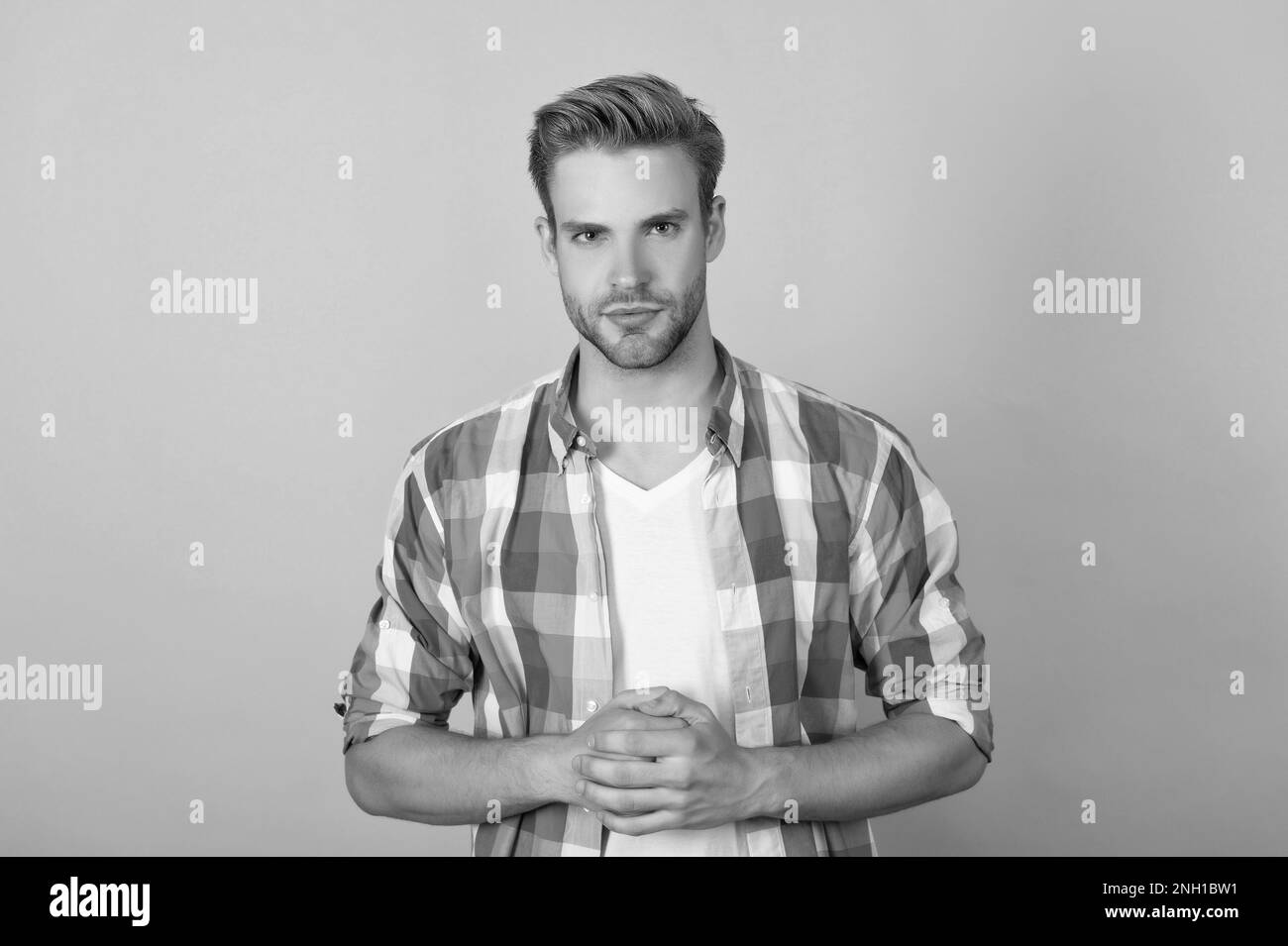 Get serious. Serious man portrait yellow background. Keeping straight ...