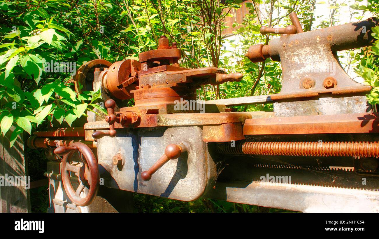 old rusty lathe Stock Photo - Alamy
