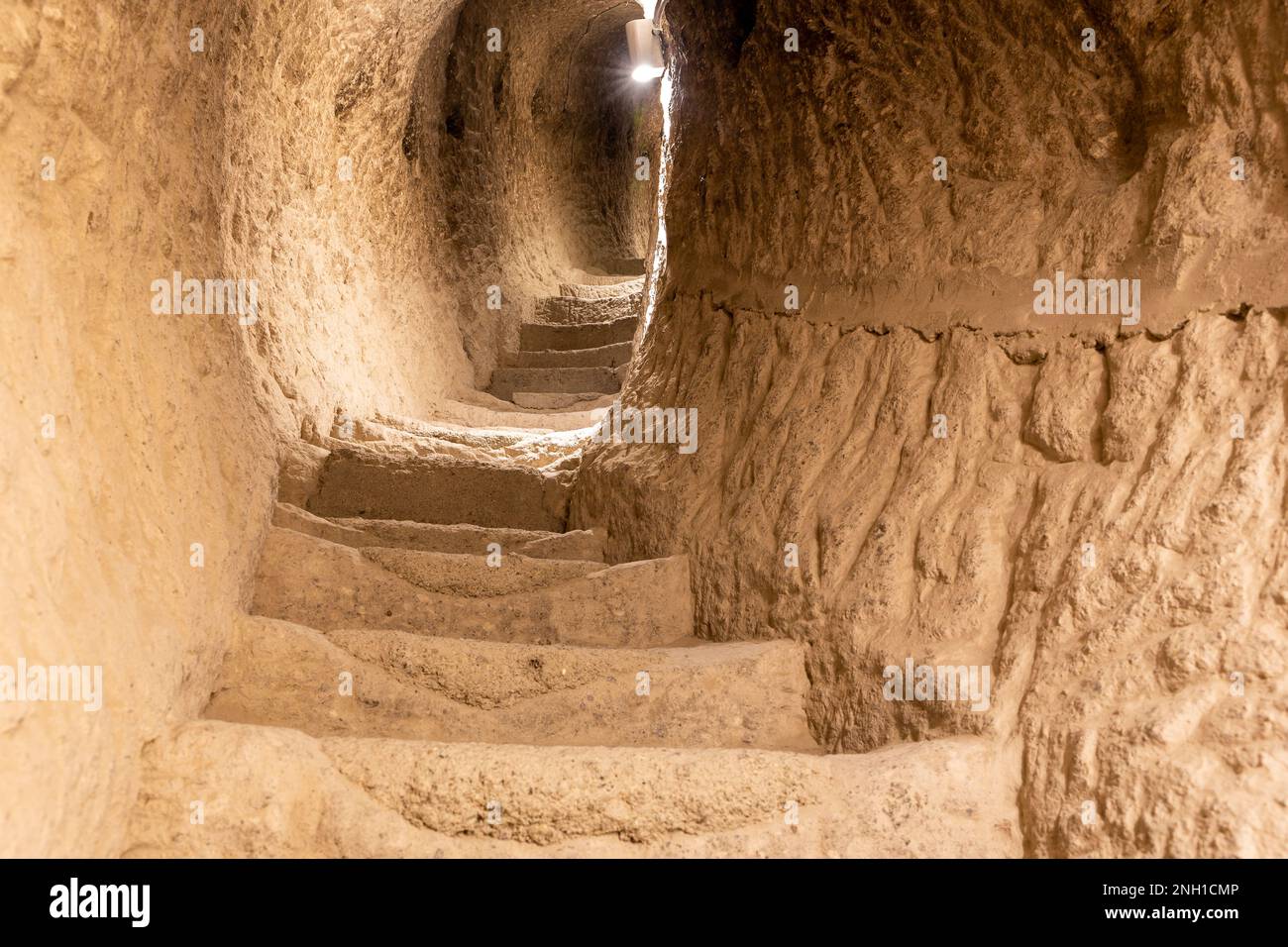 Stone tunnel and staircase drilled in the rock in Vardzia cave ...