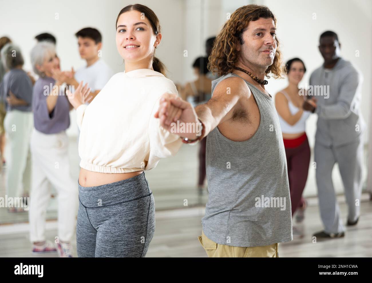 Cheerful people rehearsing dance routine hi-res stock photography and ...