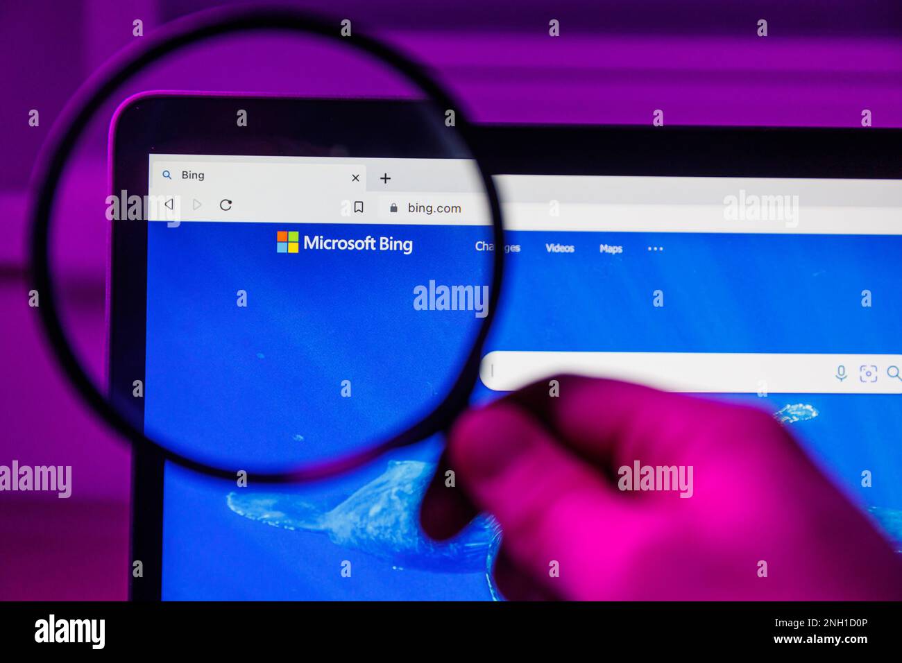 Microsoft Bing chatbot through magnifying glass on screen Stock Photo ...