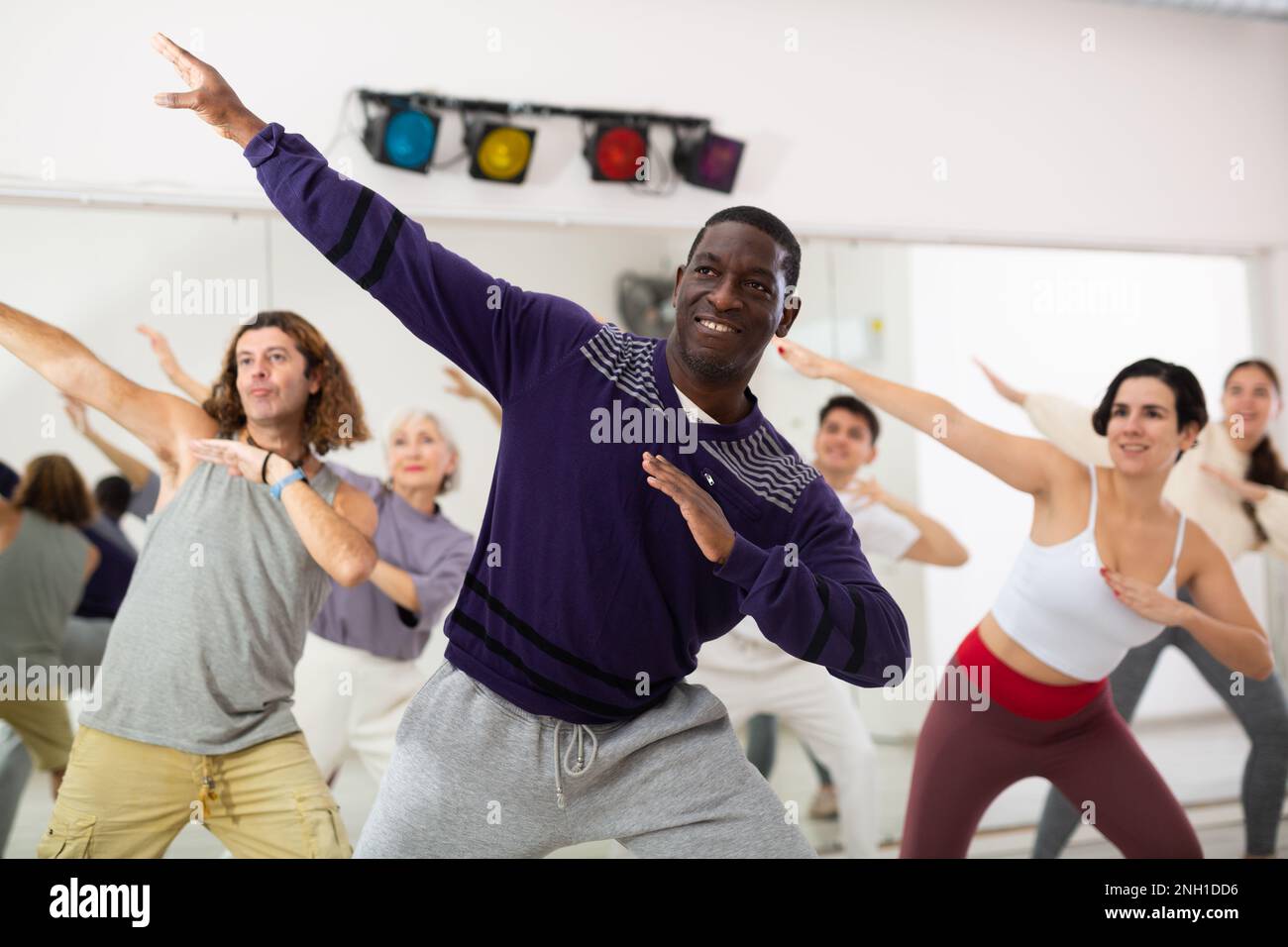 Group of adult people practices dance aerobics Stock Photo - Alamy