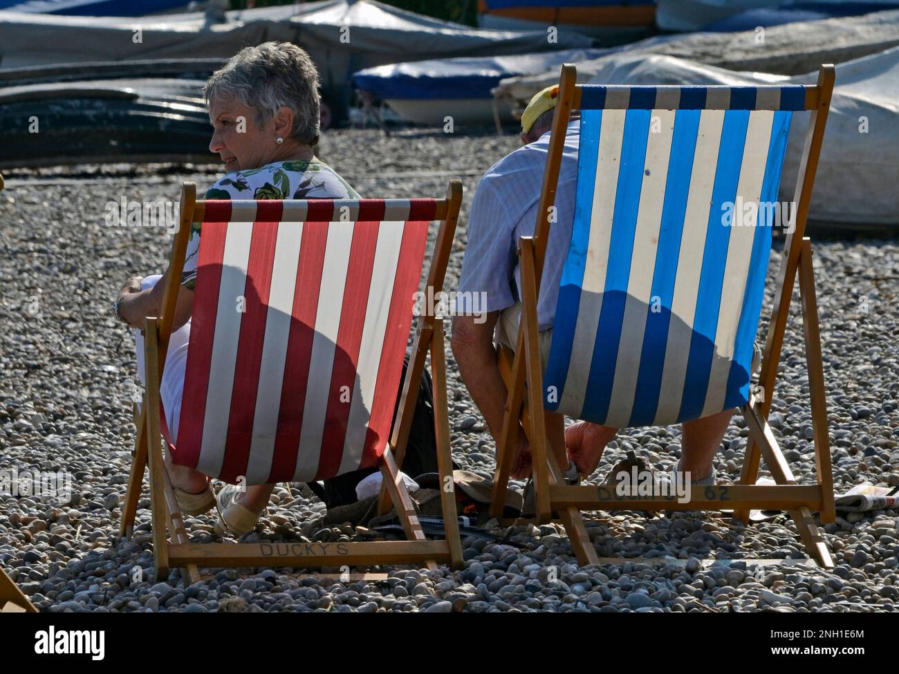 Two people sitting on deckchairs hi-res stock photography and images ...