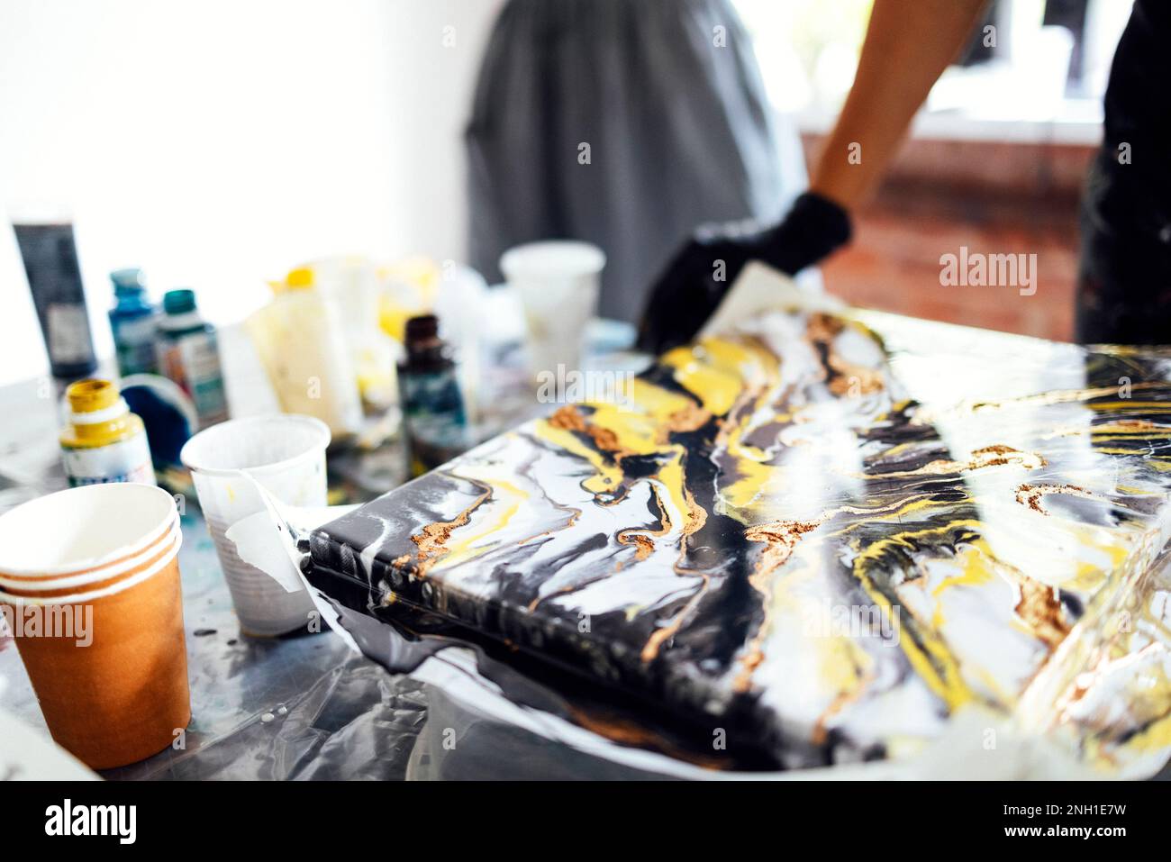 Abstract painting is made in the technique of painting with liquid ...