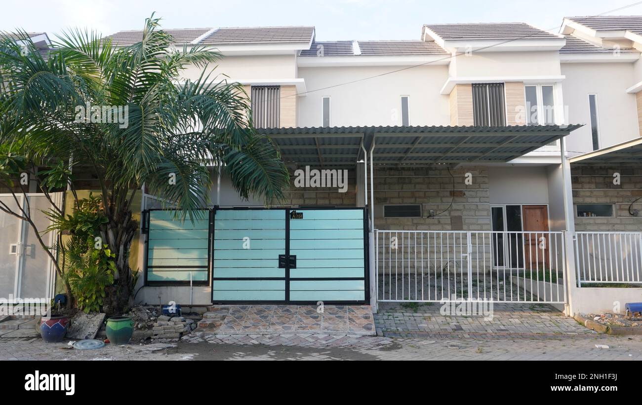 Close up a modern of house building surrounded by trees at residential ...