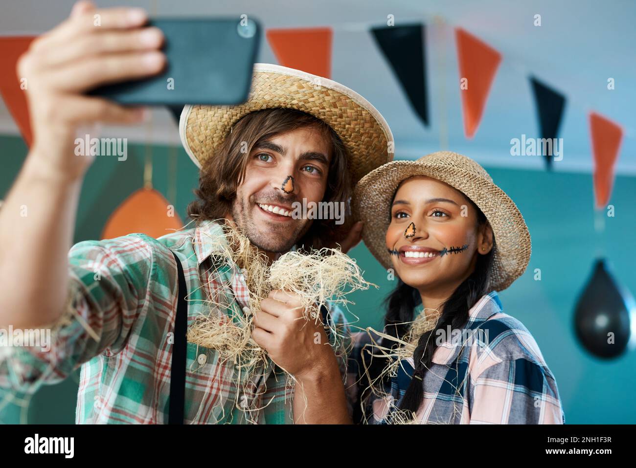 Halloween with my favourite person. a young couple taking a selfie at a ...