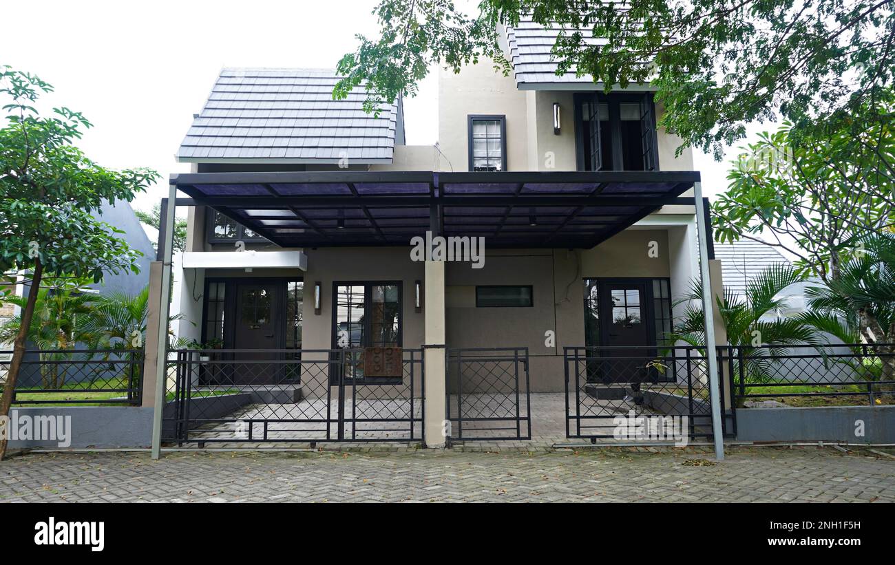 Close up a modern of house building surrounded by trees at residential ...