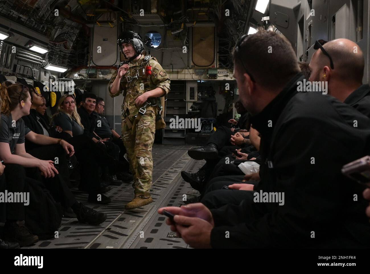 Senior Airmen Duke Edens, 535th Airlift Squadron loadmaster, speaks to ...