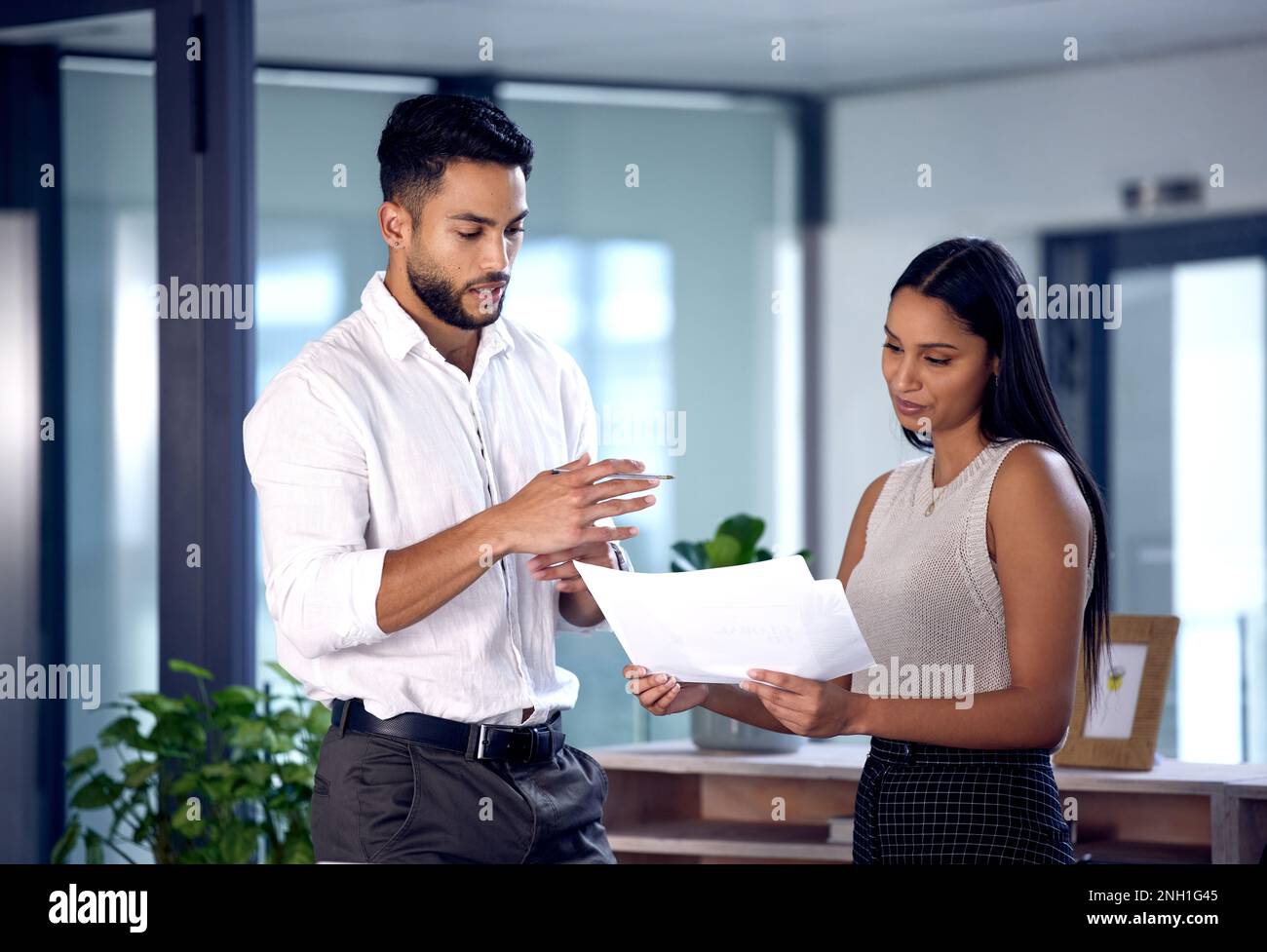 This is the final draft of my project. two work colleagues reading over ...