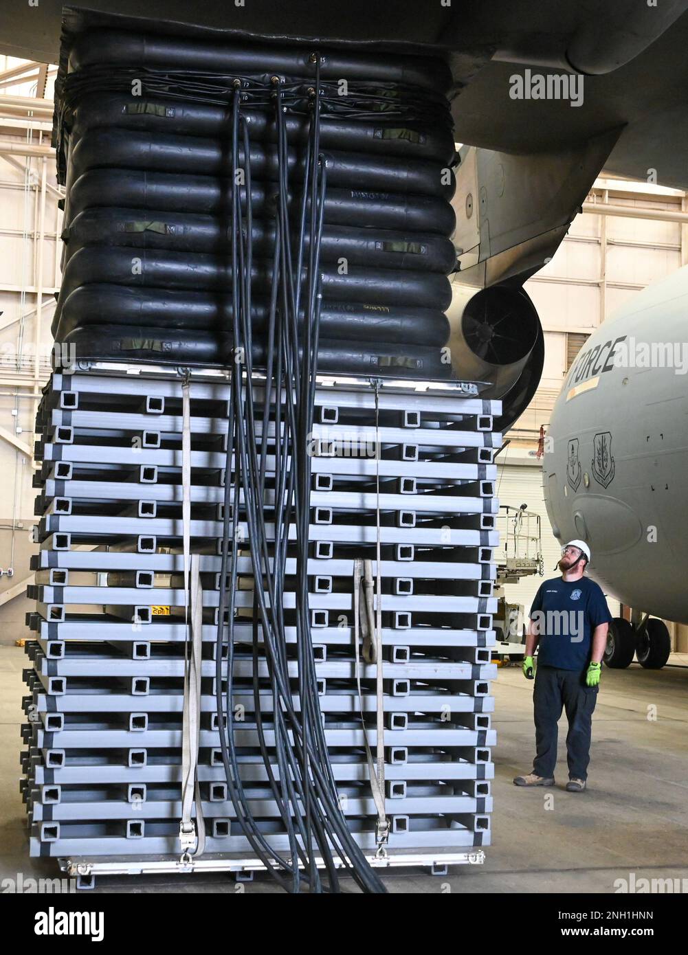 James Atwell, 97th Maintenance Squadron aircraft mechanic, looks up as ...